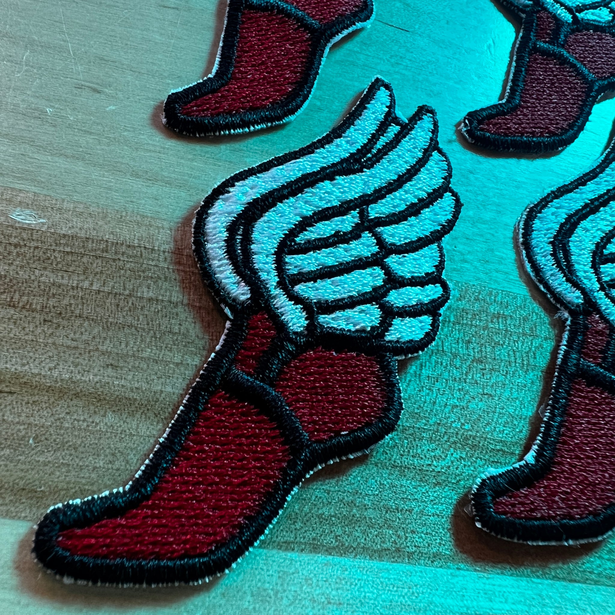 Iron on Winged Track Feet Embroidery Patches (4 Pack)